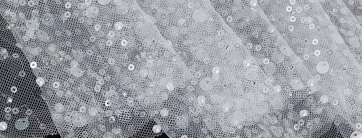 Tessuto a rete con paillettes: una scelta elegante per i tuoi progetti ...